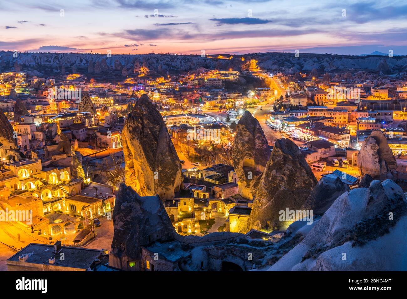 Night view of Goreme town with cave hotel built in rock formation in ...