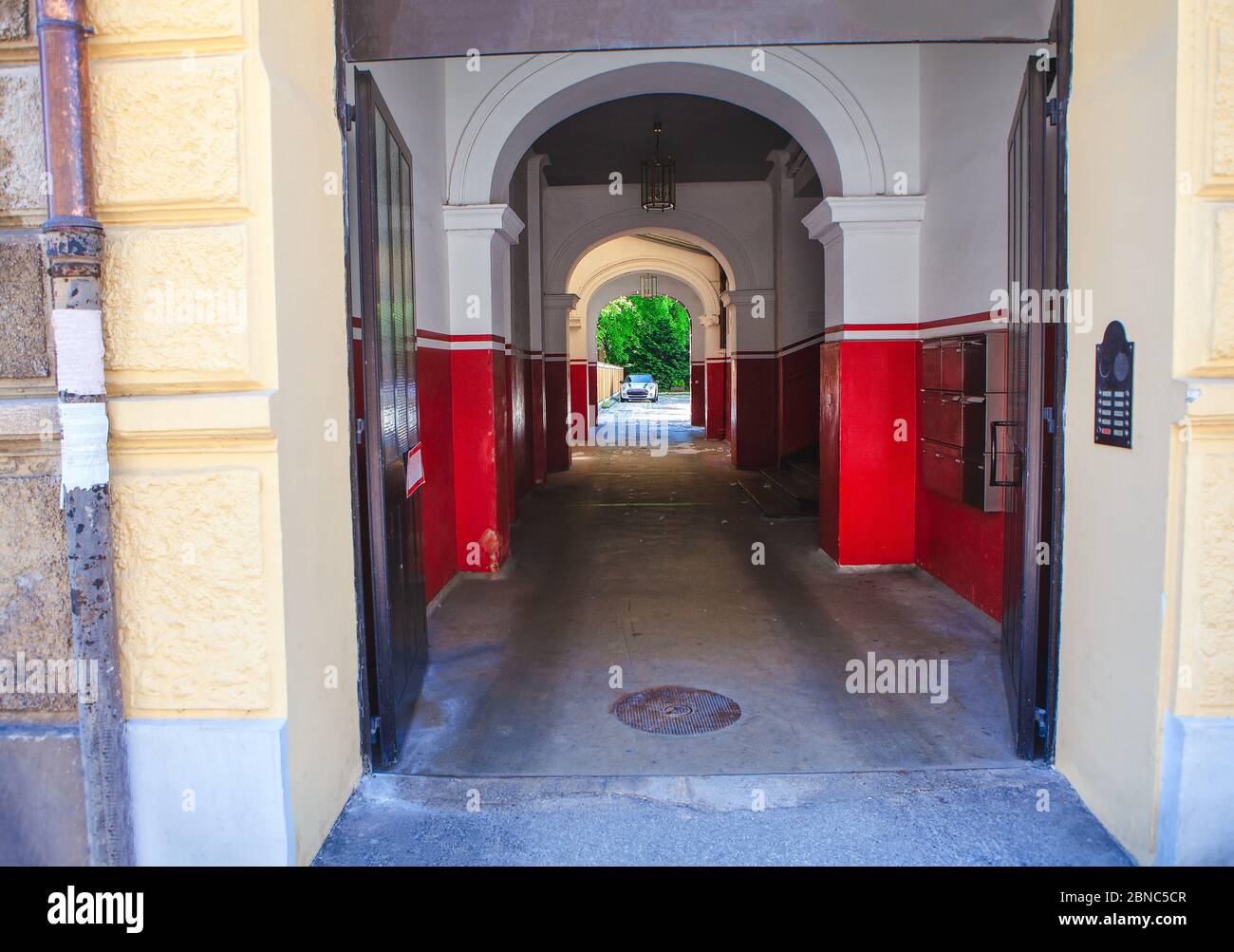 hallway with architectural arches in the town Stock Photo - Alamy
