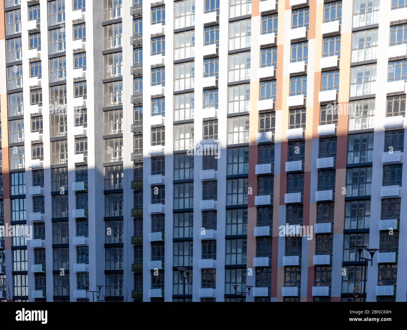 Pattern from the windows of a new multi-storey building. Window in ...
