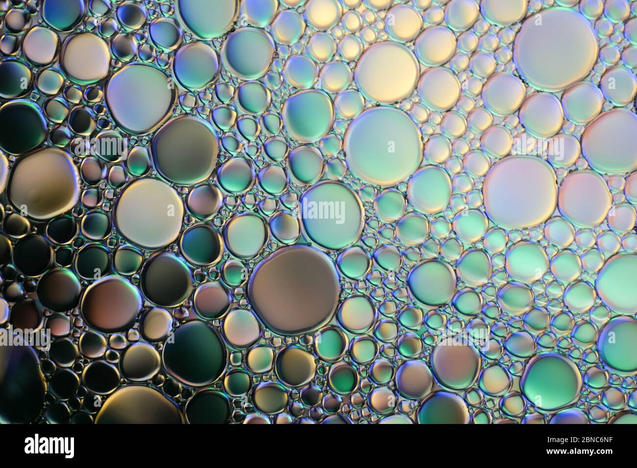 Colorful artistic of oil drop floating on the water Stock Photo - Alamy