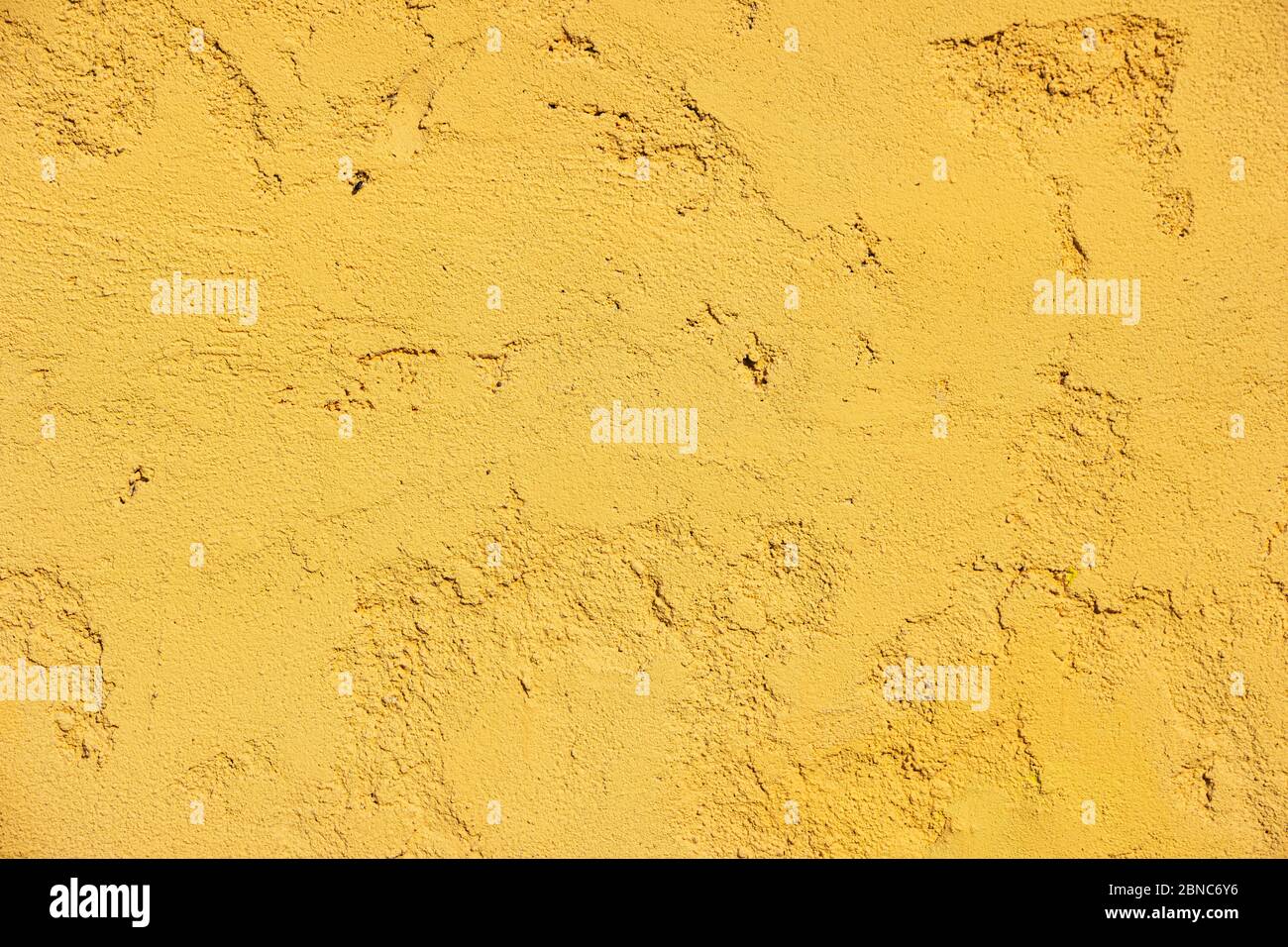 Yellow texture of a colorful painted wall Stock Photo - Alamy