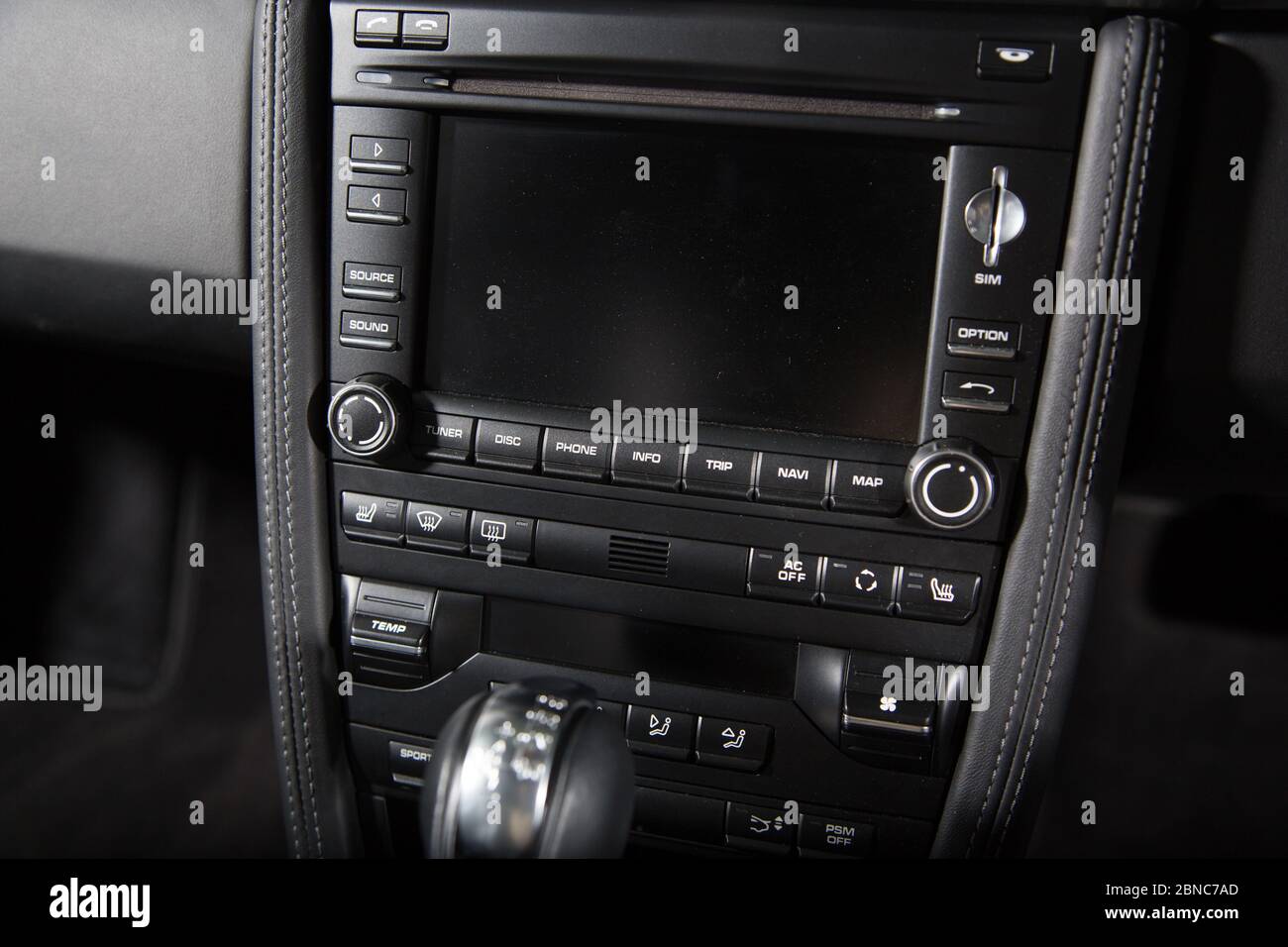Closeup of the screen and control buttons of a modern car under the ...
