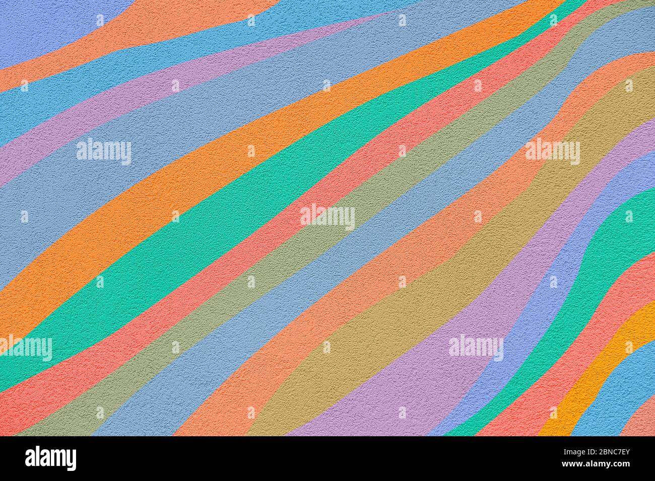 Multicolor painted background from building wall. Different colors ...