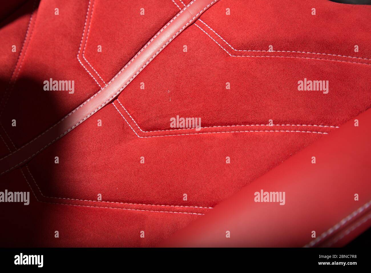 Closeup of a red seat of a modern car under the lights Stock Photo - Alamy