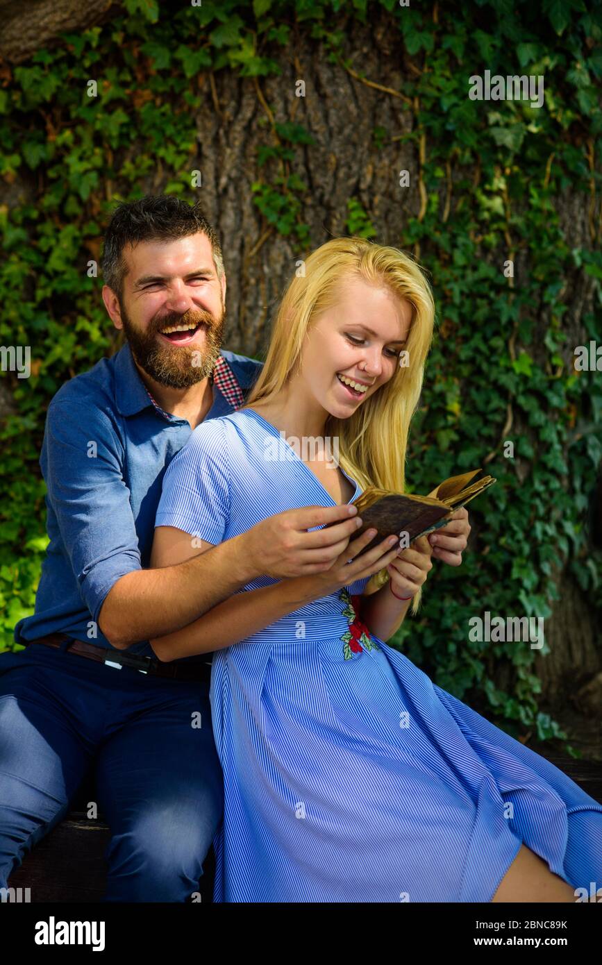 Love and fun concept. Couple in love hugs outdoor and laughing, nature ...