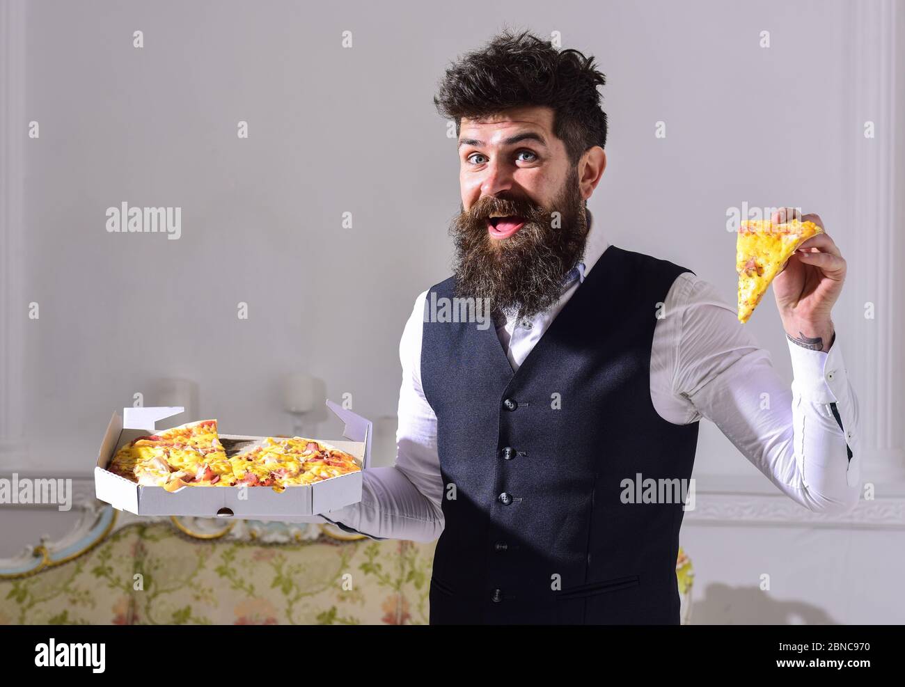 Man with beard and mustache holds box with tasty fresh hot pizza. Food ...