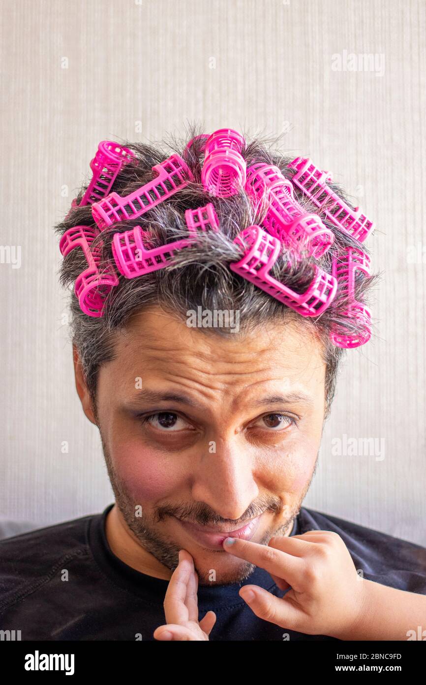 Handsome father is being makeup by the hands of his daughters Stock ...