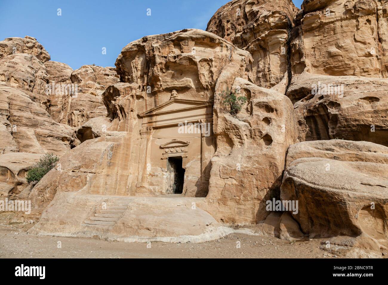 View of a rock cave in Petra in Jordan Stock Photo - Alamy