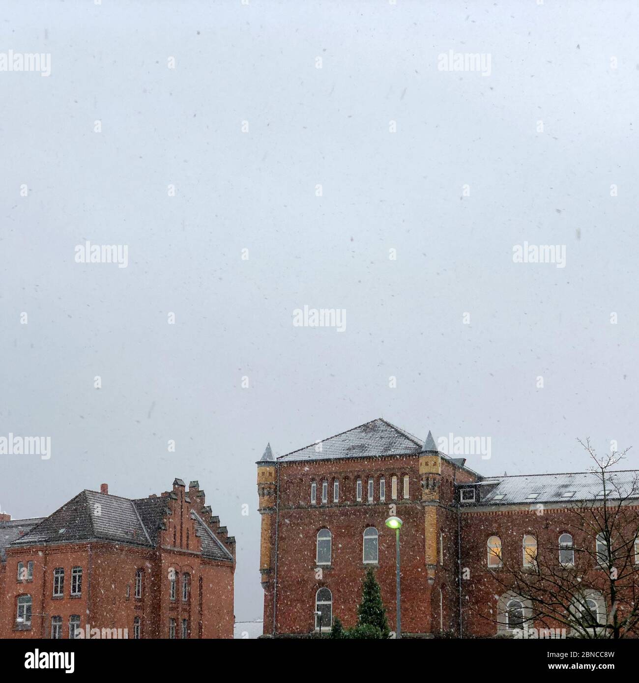 Brick buildings during a snowy weather Stock Photo - Alamy
