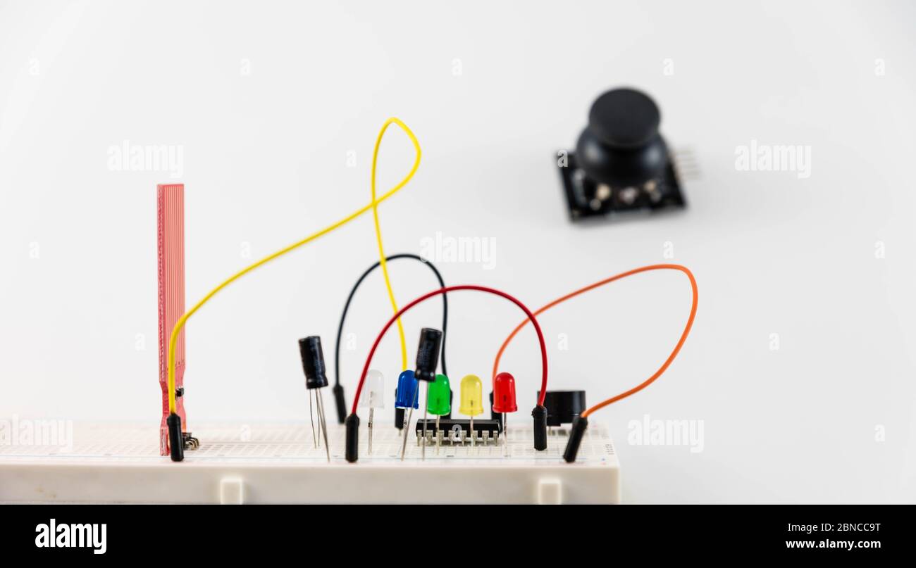 Microcontrollers, chips, resistors and light-emitting diodes on white ...