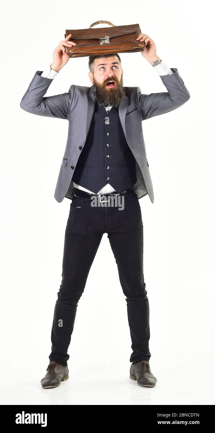 Hipster with worried face, stylish haircut and vintage briefcase ...