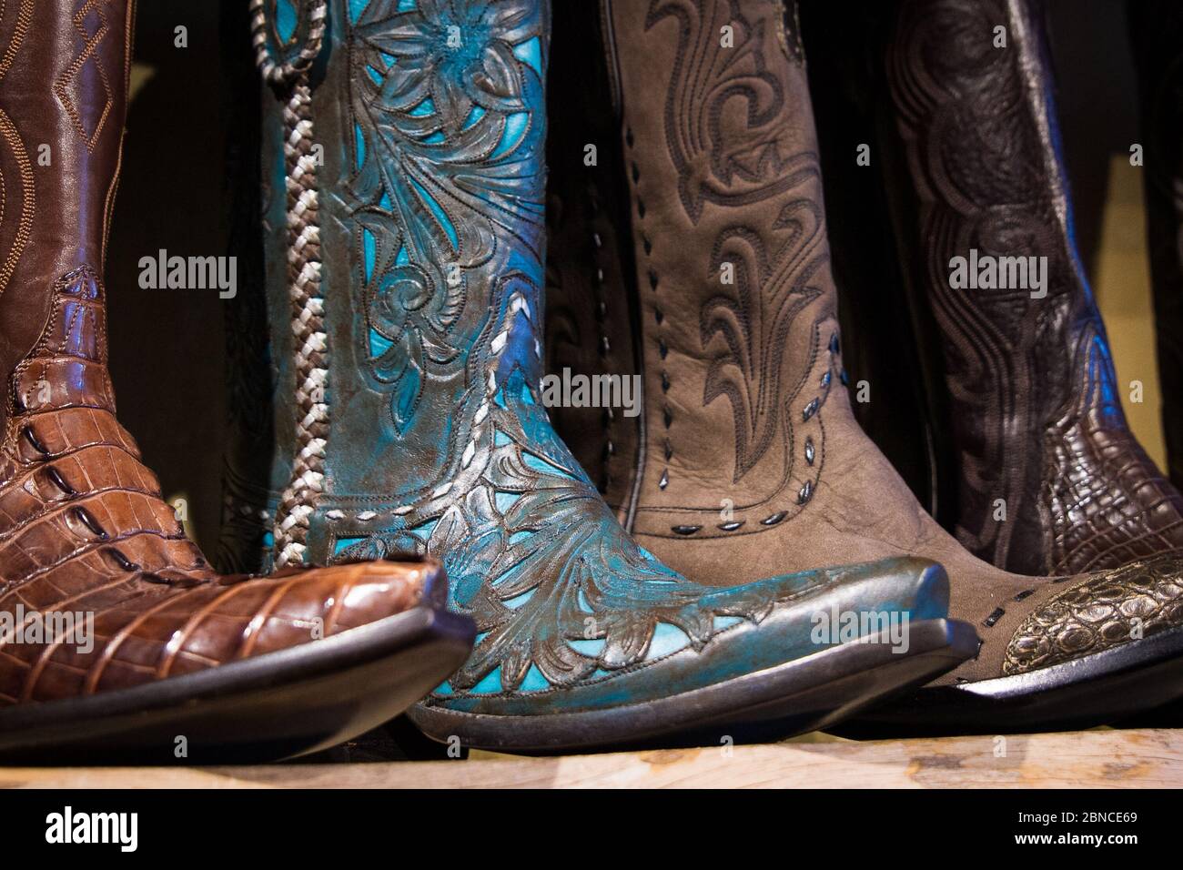 A collection of cowboy boots for sale Stock Photo - Alamy