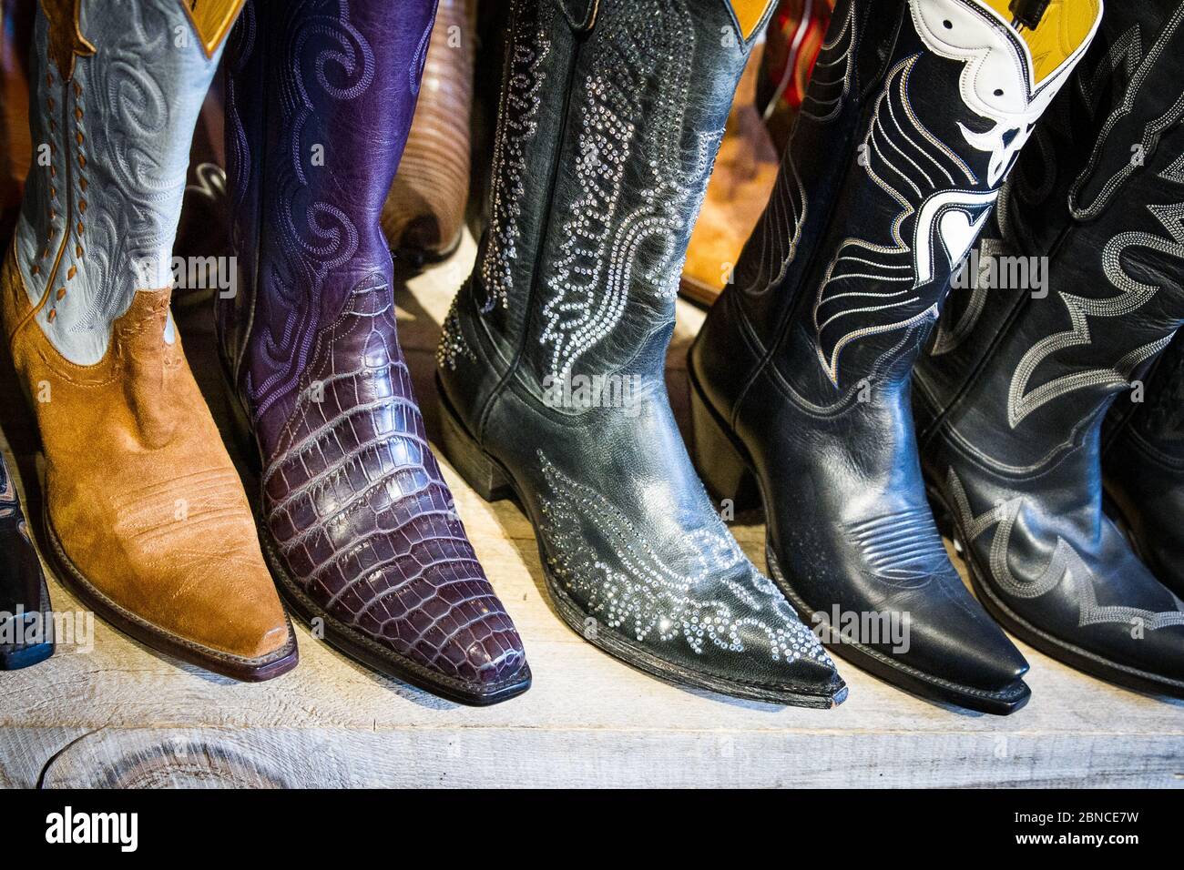 A collection of cowboy boots for sale Stock Photo - Alamy