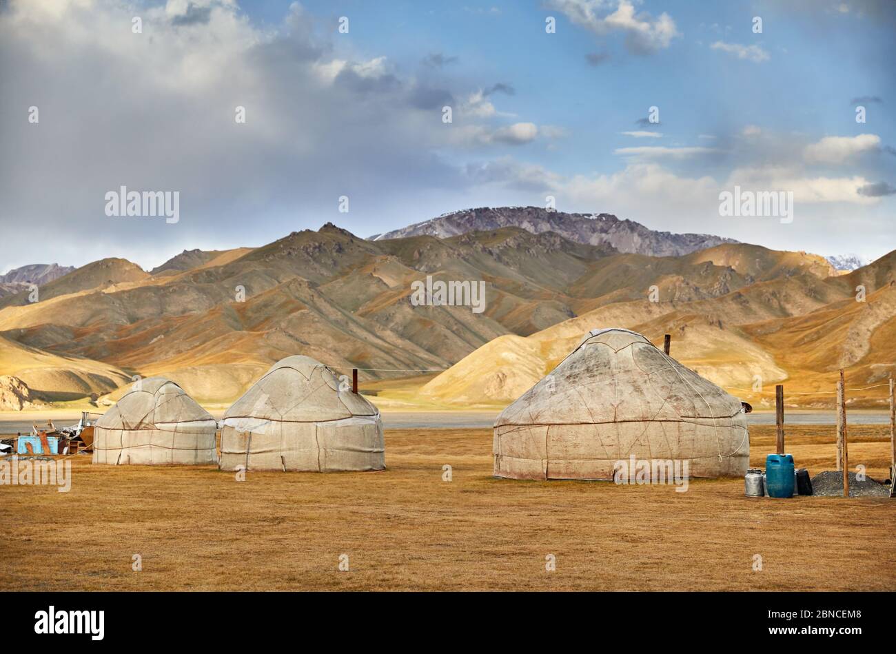 Yurt nomadic houses camp at mountain valley in Central Asia Stock Photo ...