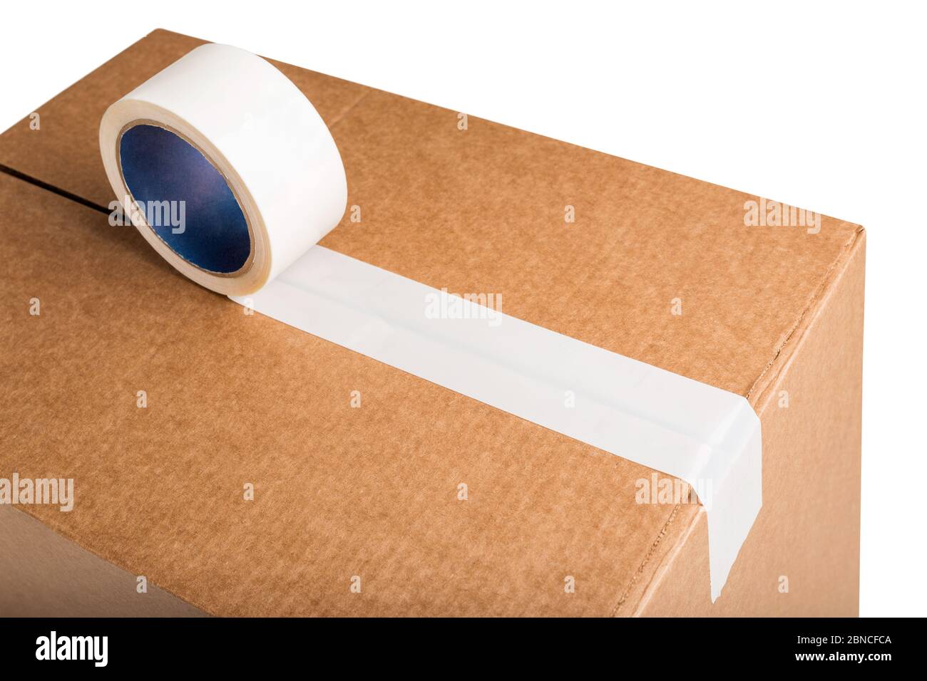 Closeup of cardboard box with white adhesive tape isolated on white ...