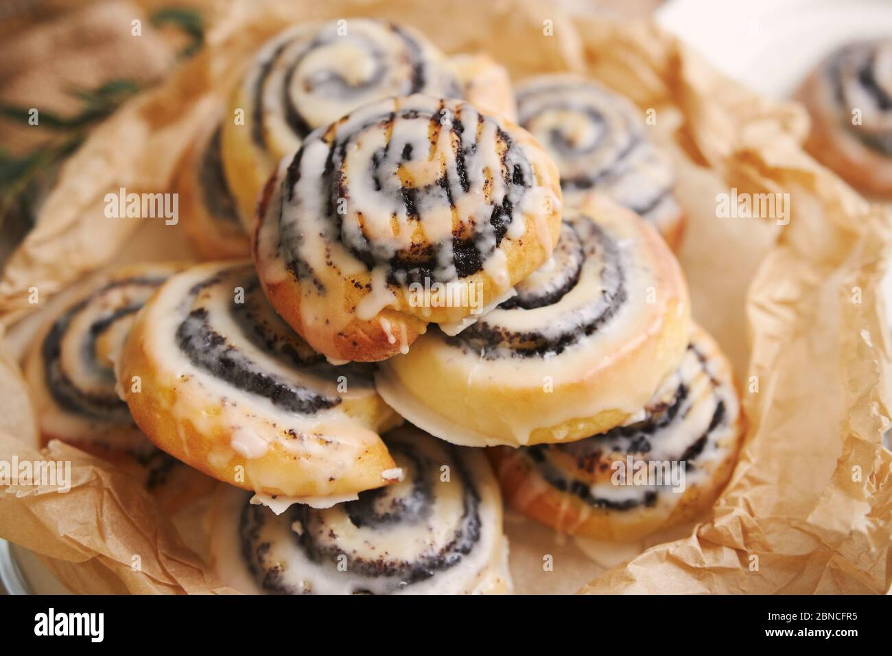 Closeup picture of delicious Poppy snail pastries with a sugar glaze on ...