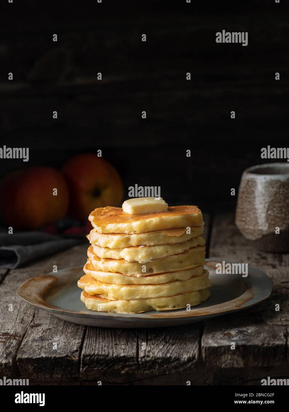 Pancake with butter. Side view, copy space, vertical. Dark moody old ...
