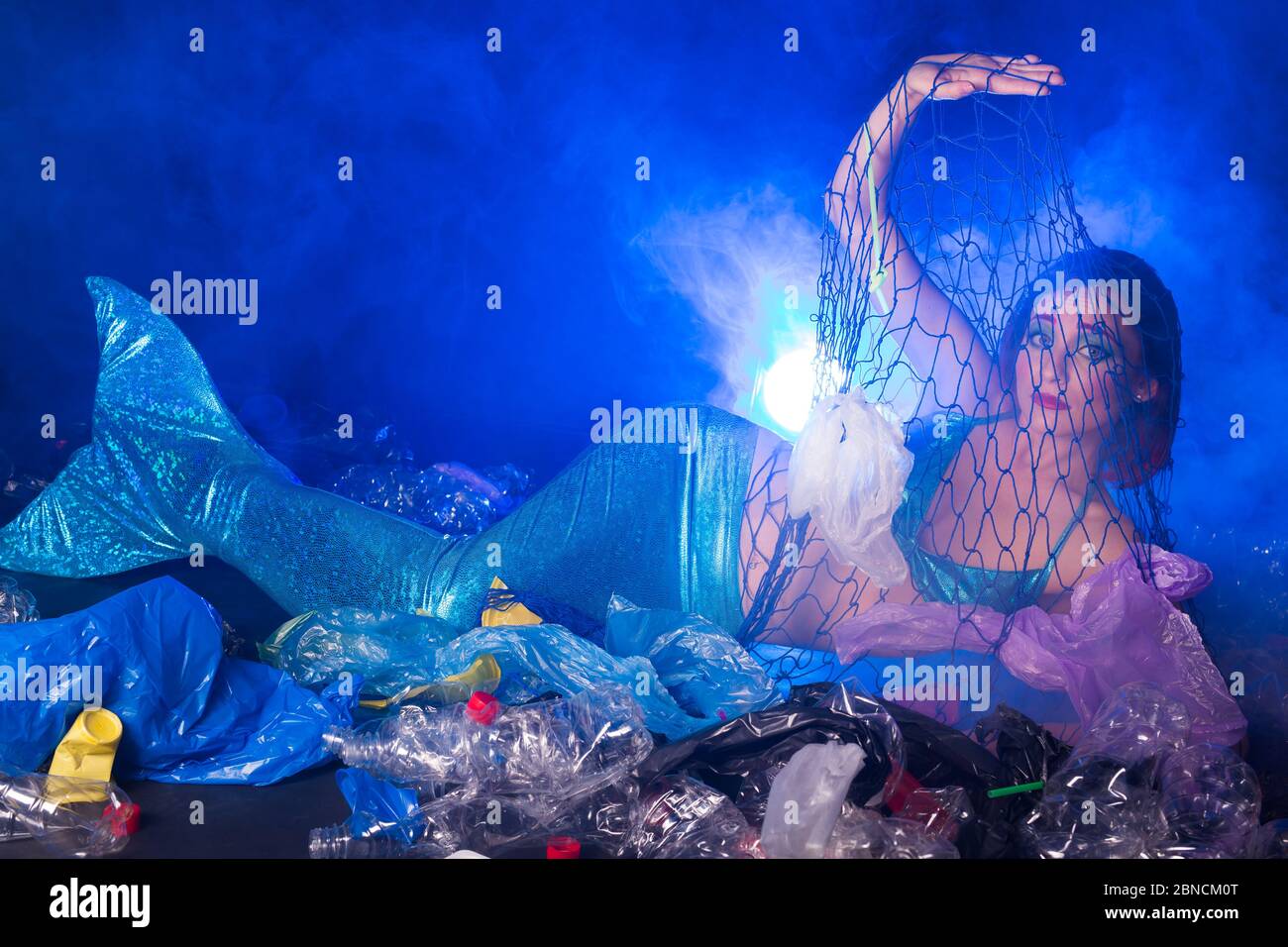 Ocean pollution, rubbish in the water. Sad fairytale mermaid in dirty ...