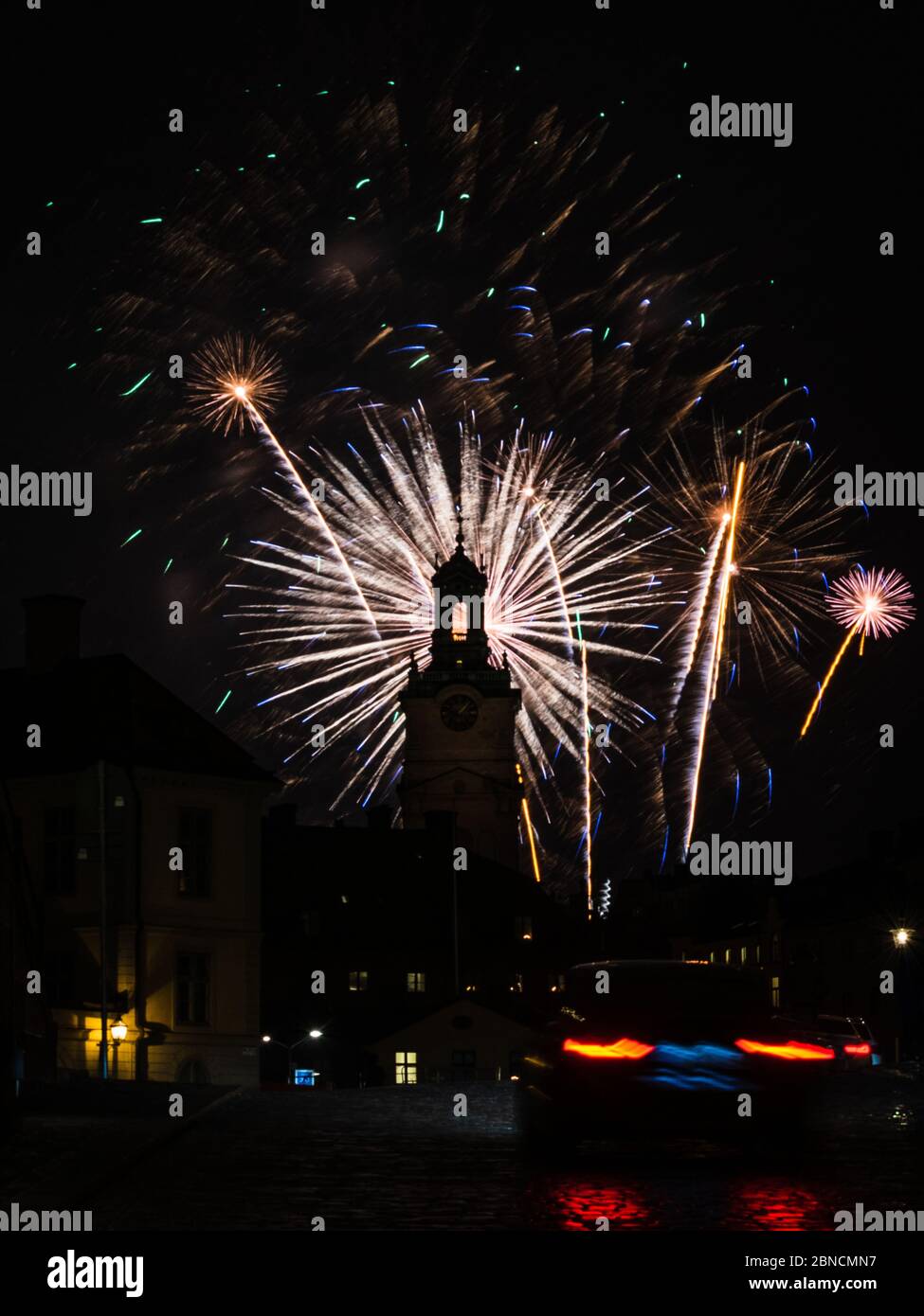 Mesmerizing view of the colorful fireworks behind the buildings at ...
