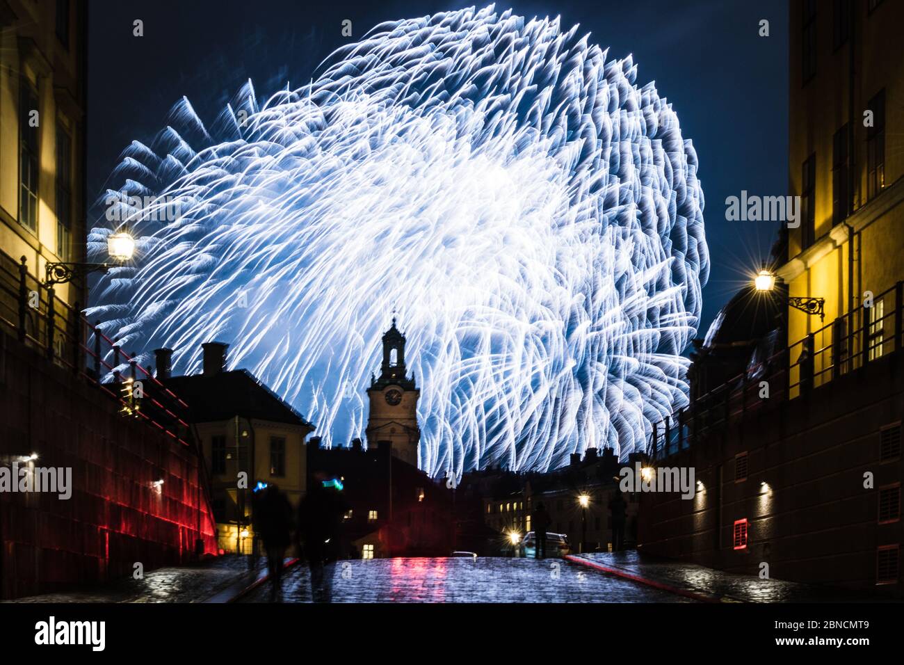 Mesmerizing view of the colorful fireworks behind the buildings at ...