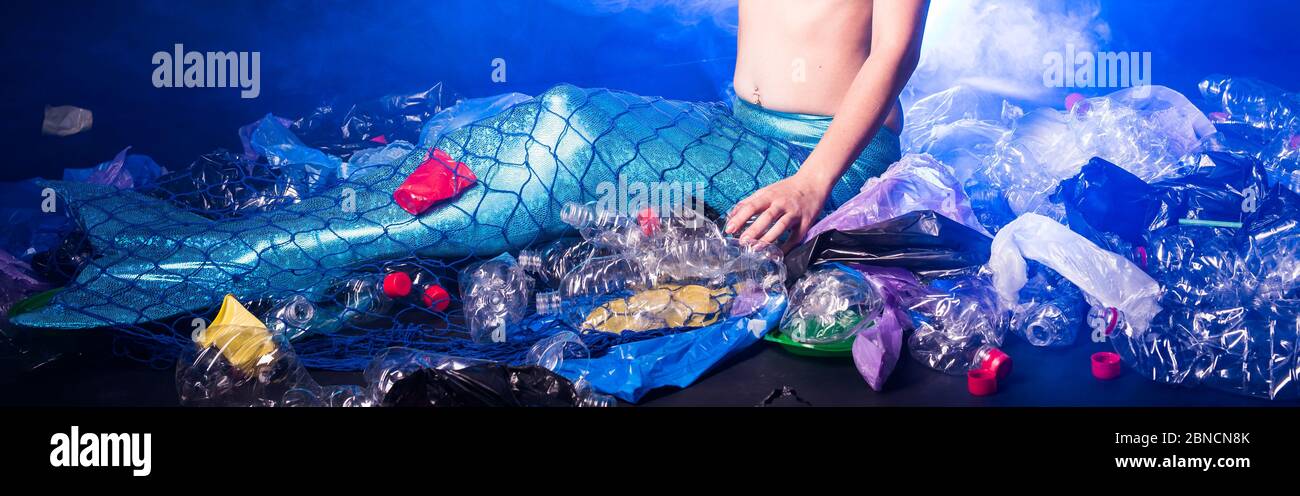 Close-up of fantasy mermaid in deep ocean shocked because water ...