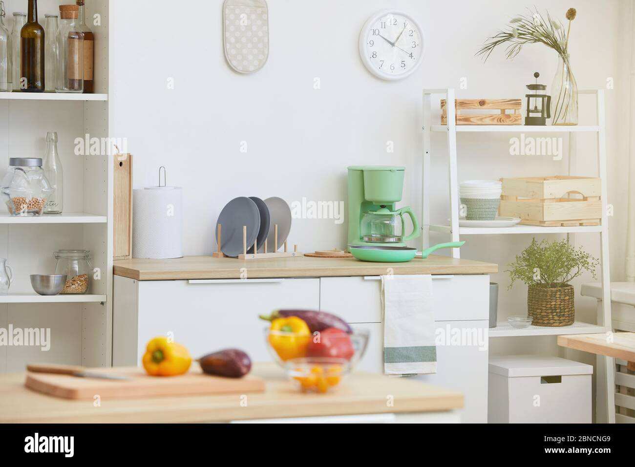 Image of domestic modern kitchen with kitchen table with vegetables on ...