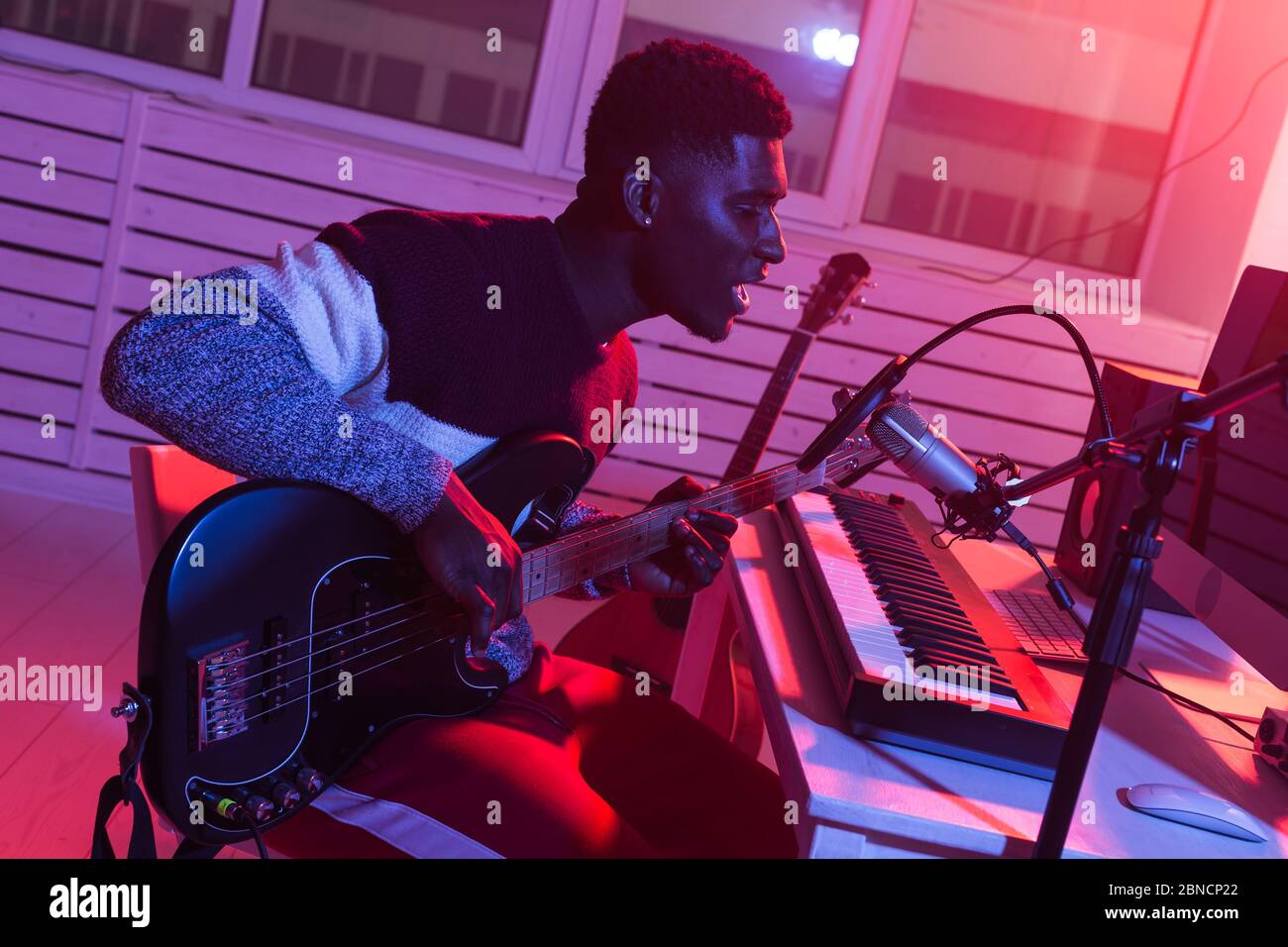 Create music and a recording studio concept - african american man ...