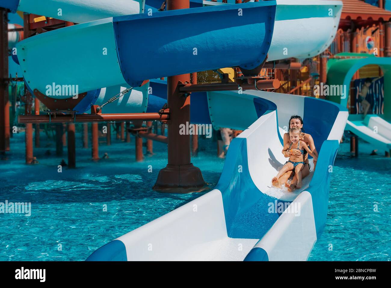 Girl slide slides splash hi-res stock photography and images - Alamy