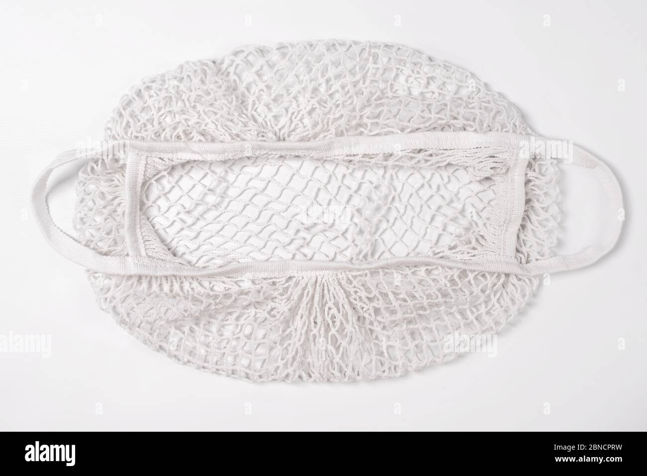 Empty reusable cotton shopping string bag on white background. Eco ...