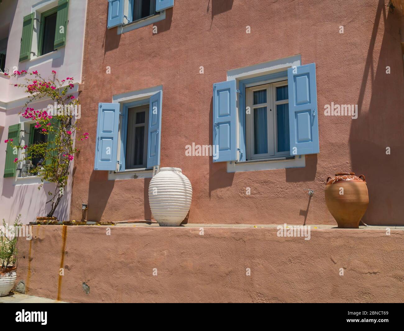 beautiful Greek house with blue shutters in the pretty village of Assos ...