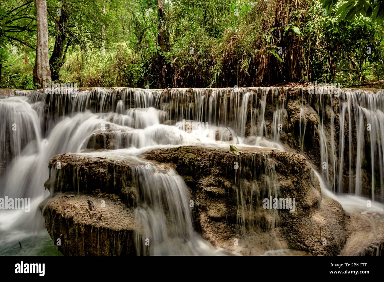 Beautiful shot of waterfalls in the forest Stock Photo - Alamy