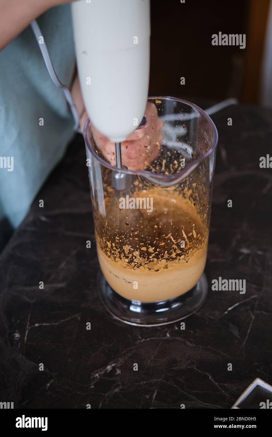 Making Dalgona Coffee at home, Preparing Homemade Dalgona Coffee Stock ...