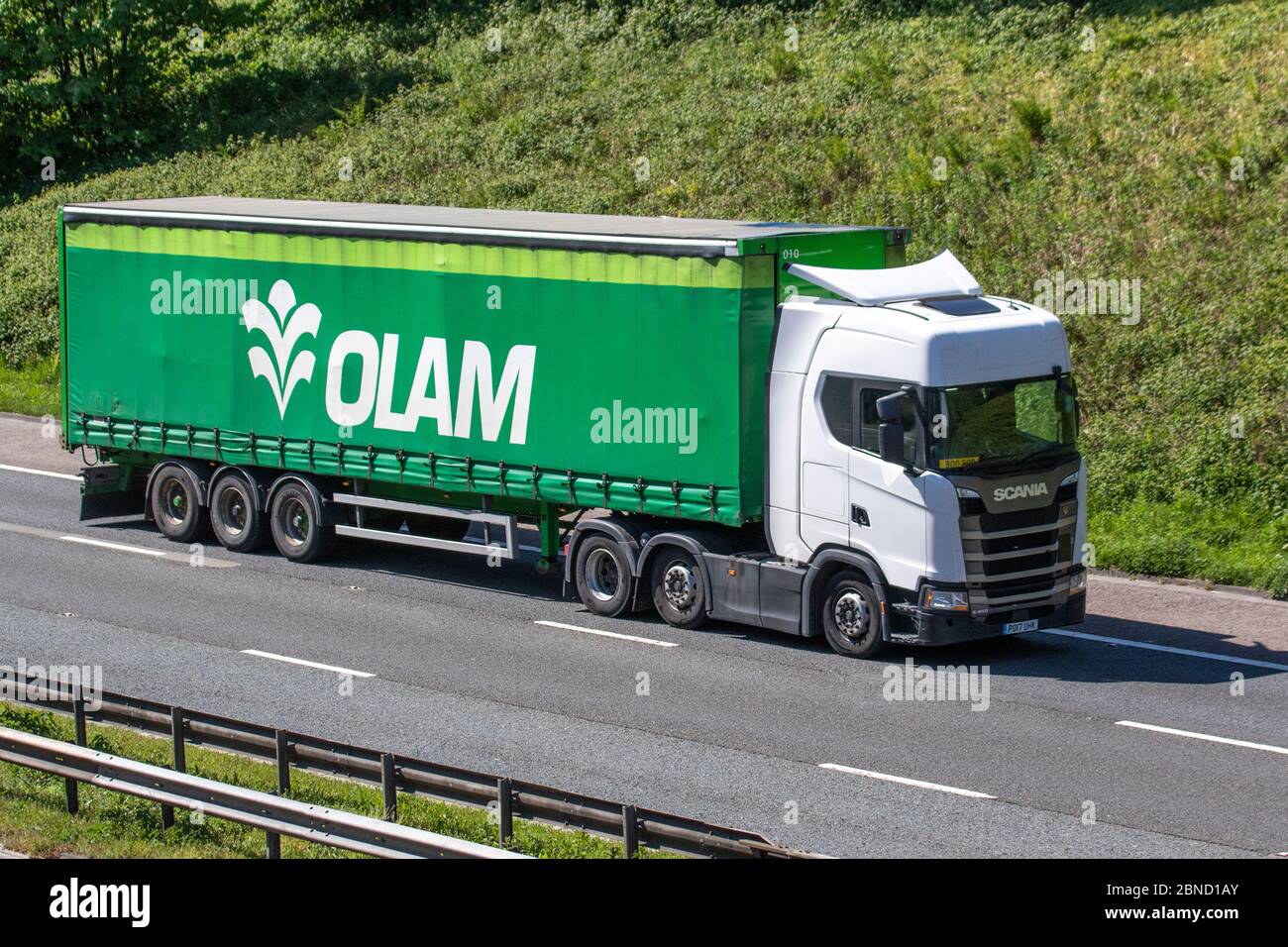 Olam International; Haulage delivery trucks, green lorry ...
