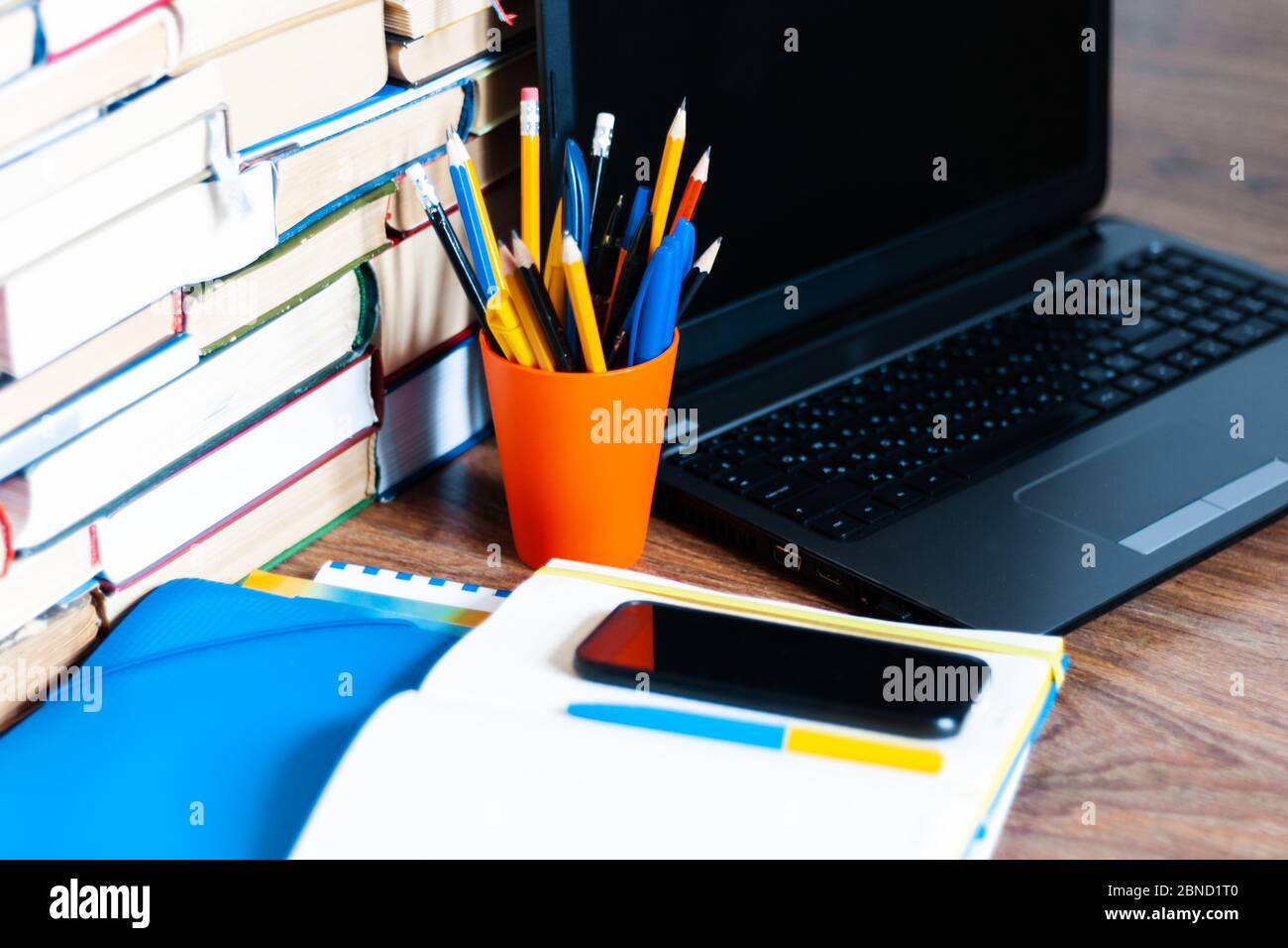 Textbook, notebook, laptop computer, mobile phone smartphone, stack of ...