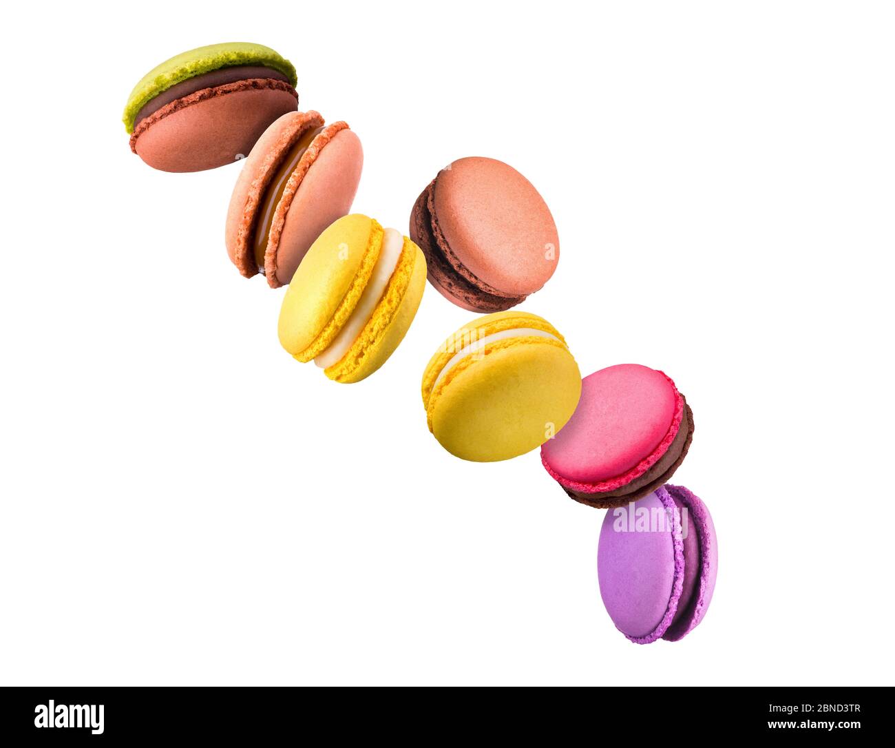 Set of flying french colorful macaroons isolated on white background ...