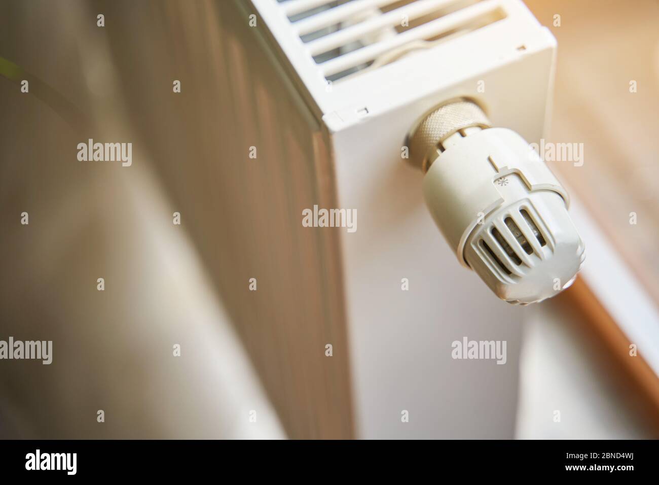 Radiator in the apartment. White heated battery Stock Photo - Alamy