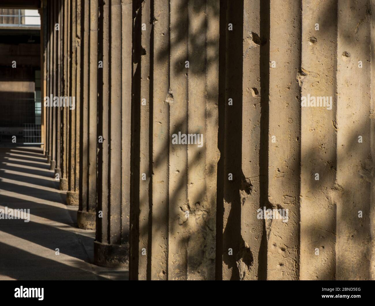 Bullet holes on pillars in central Berlin Stock Photo - Alamy
