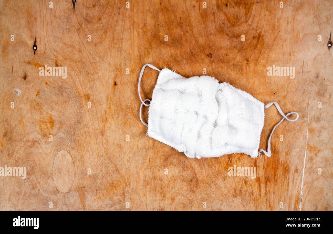 Protective mask on the table. Top view Stock Photo - Alamy