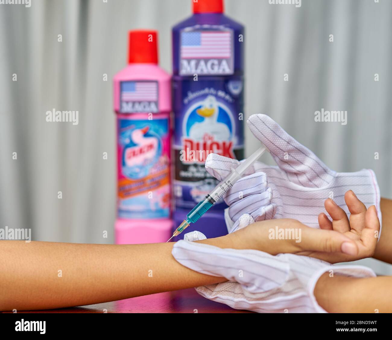 Bottles of detergent and injection needle with syringe Stock Photo - Alamy