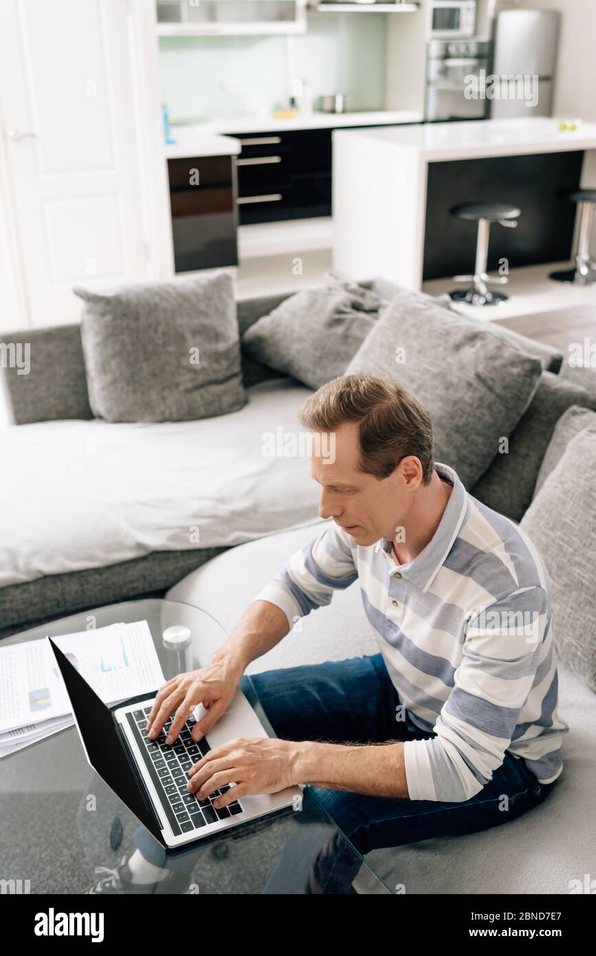 freelancer typing on laptop keyboard in living room Stock Photo - Alamy