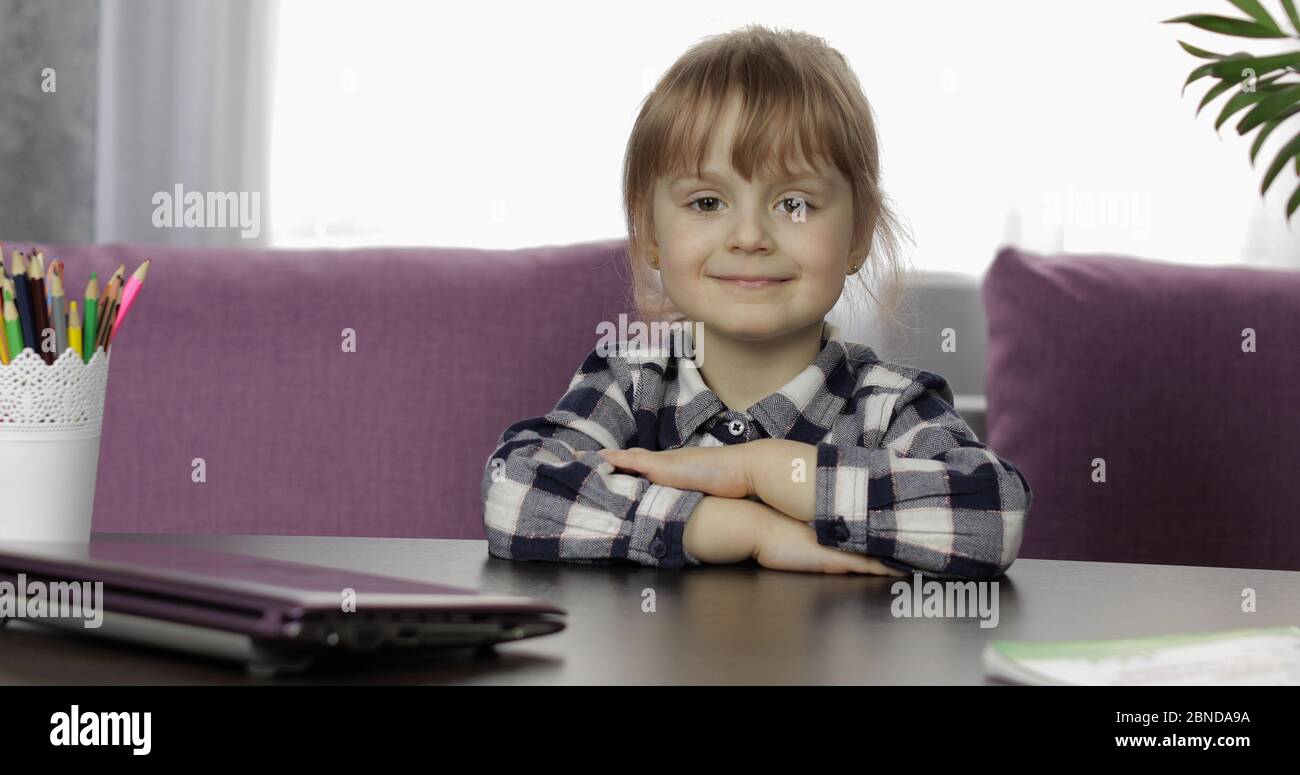 Pretty preschool girl distance online learning at home. Cute kid ...