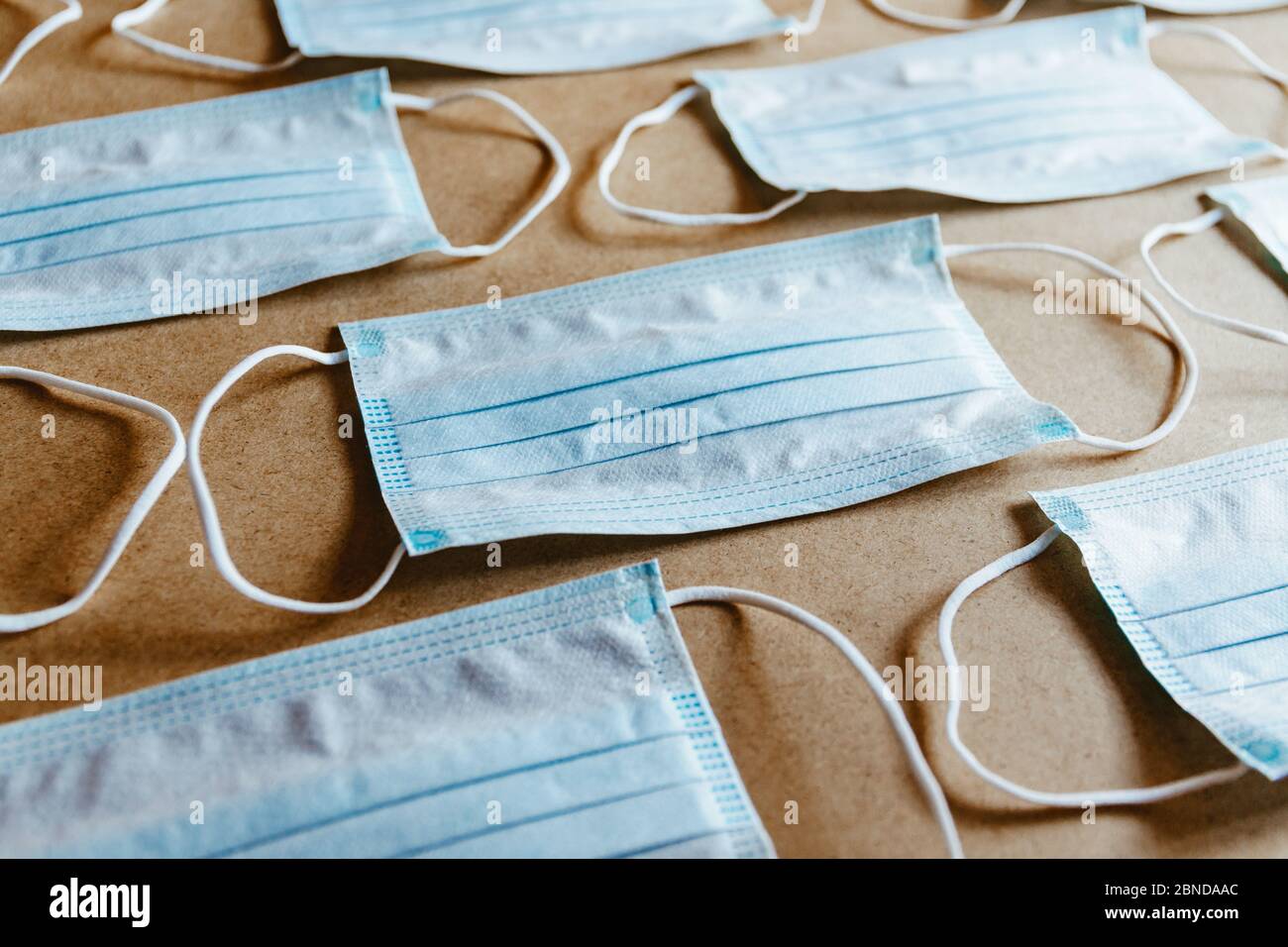 Blue medical masks on table hi-res stock photography and images - Alamy