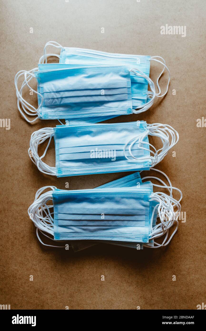 Blue medical masks on table hi-res stock photography and images - Alamy
