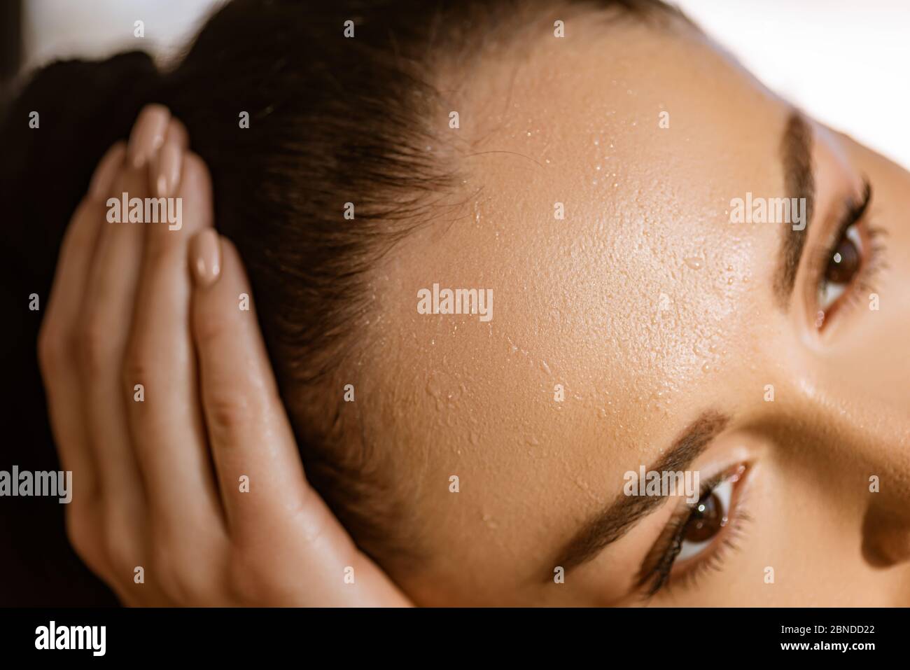 Close up view of female face with hand on white background Stock Photo ...