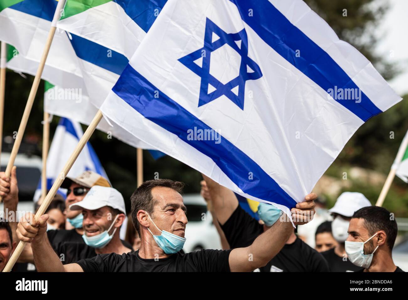 Jerusalem, Israel. 14th May, 2020. Participants wave Israeli flags as ...