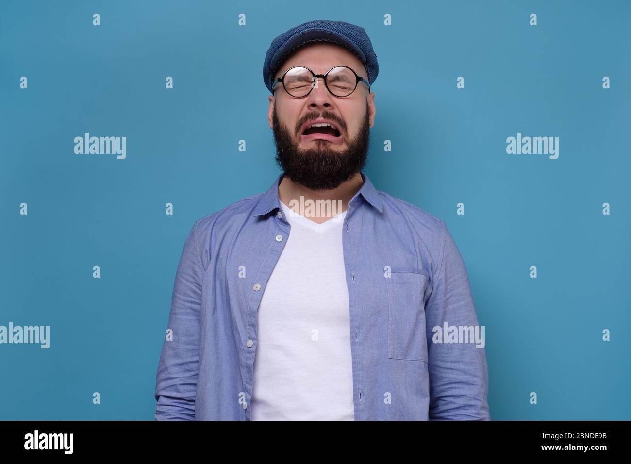 Man in cap crying hi-res stock photography and images - Alamy