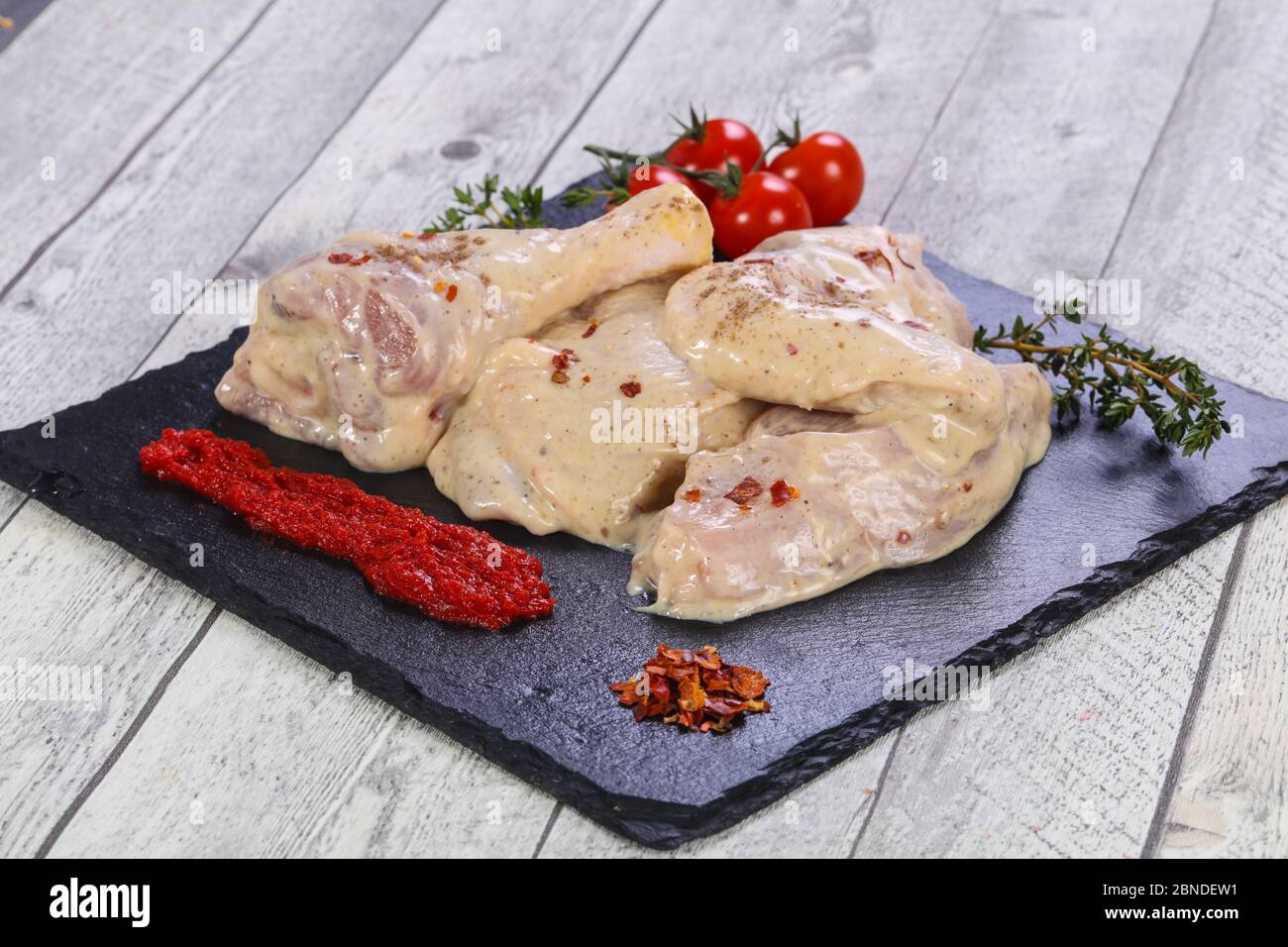 Marinated chicken parts ready for roast Stock Photo - Alamy