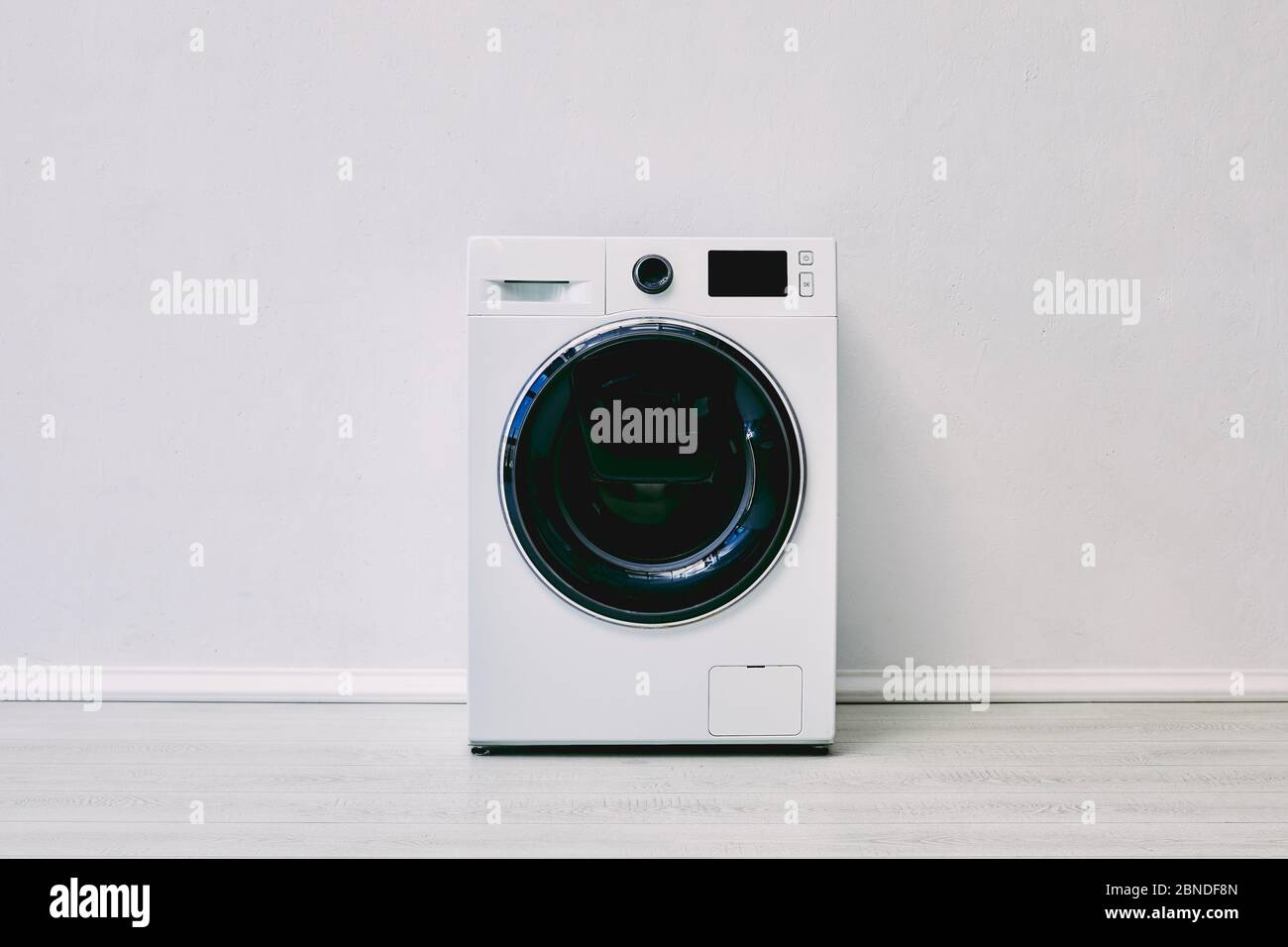 modern washing machine near white wall in bathroom Stock Photo - Alamy