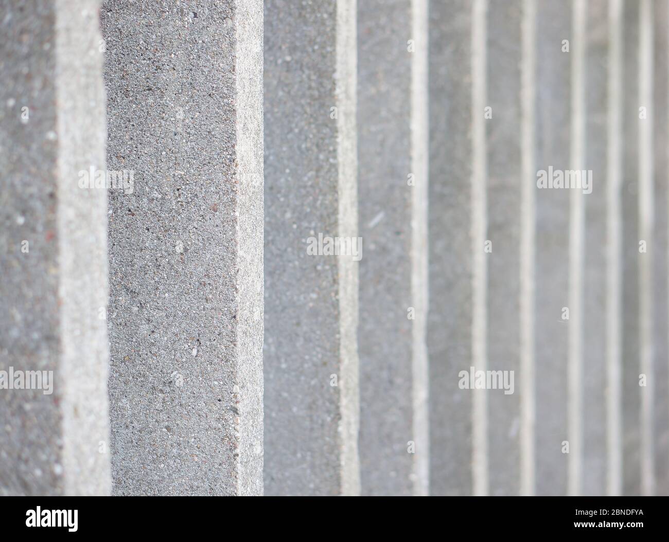 Closeup of square stone columns of a building under the sunlight with a ...