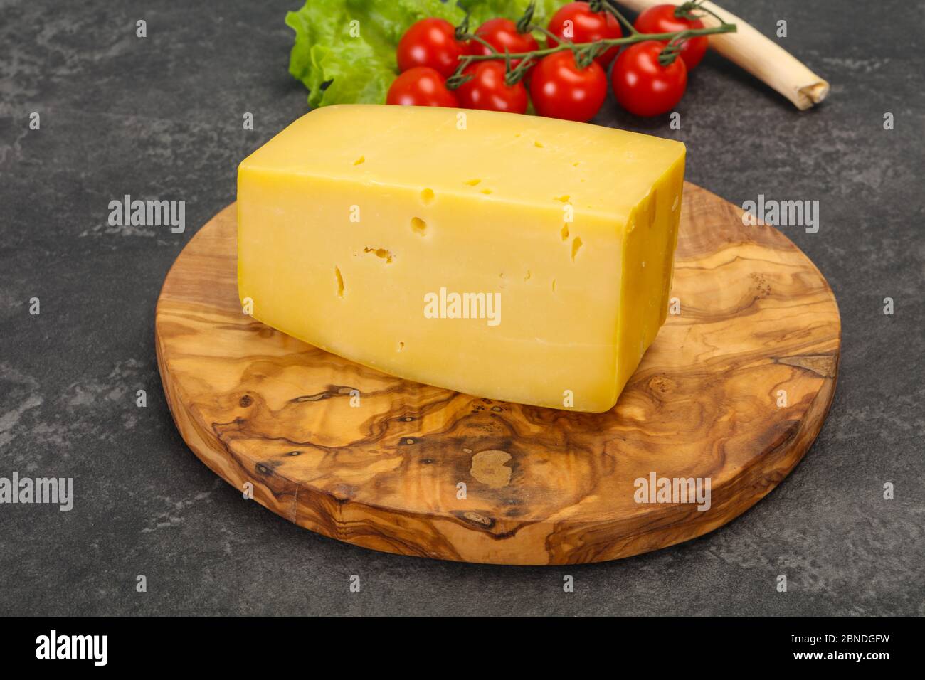 Swiss Hard yellow tasty cheese brick Stock Photo - Alamy